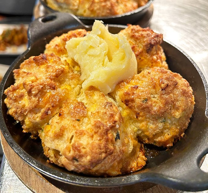 These aren't just scallion biscuits; they're buttery clouds of joy. The honey butter melting into those golden crevices is what dreams are made of.