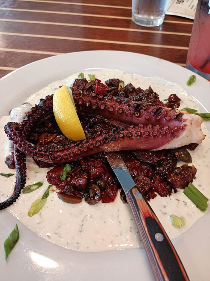 This grilled octopus isn't just a dish—it's an eight-armed ambassador of flavor. Perfectly charred tentacles rest on a creamy canvas that would make Neptune himself request seconds.