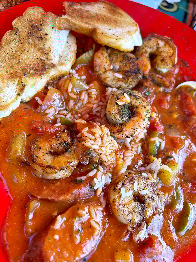 The seafood gumbo arrives like a spicy, steaming postcard from New Orleans. Plump shrimp nestled in tomato-rich broth with rice – comfort food that hugs you from the inside.