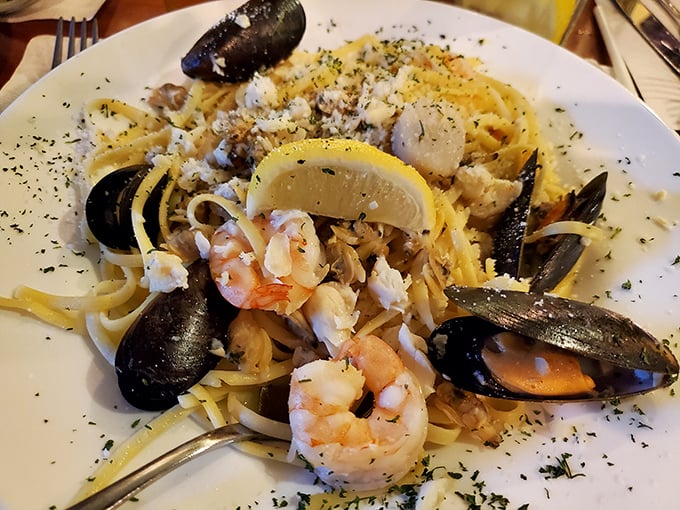 Seafood linguini that would make Neptune himself swim upstream. Those plump shrimp and mussels aren't just posing—they're showing off.