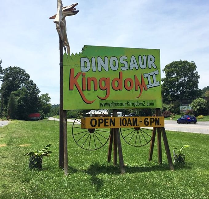 The roadside sign announces operating hours with prehistoric flair – your first clue this isn't your average historical attraction.