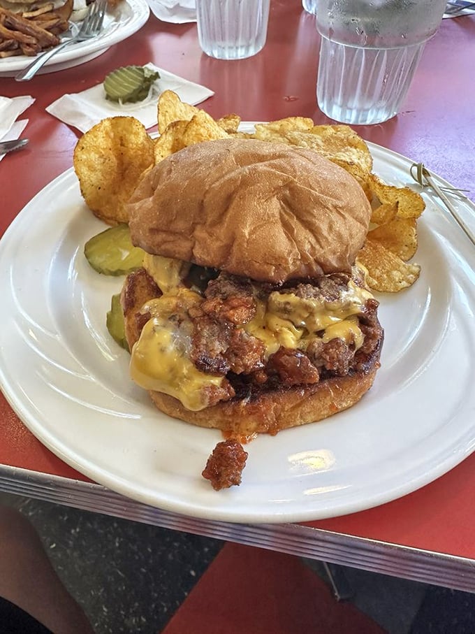 The Sloppy Burger doesn't care about your shirt's cleanliness. This magnificent mess of melted cheese and seasoned beef demands your full attention—and possibly an extra napkin.