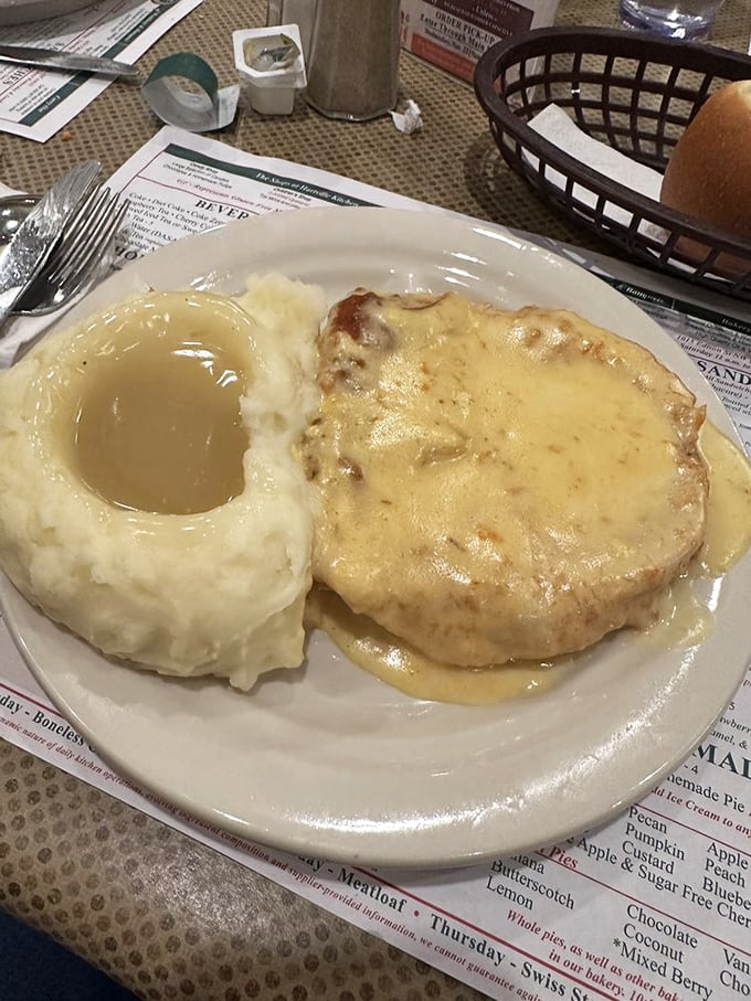 Mashed potatoes with a gravy lake deep enough to dive into, paired with chicken smothered in creamy goodness. Comfort food that hugs you from the inside.