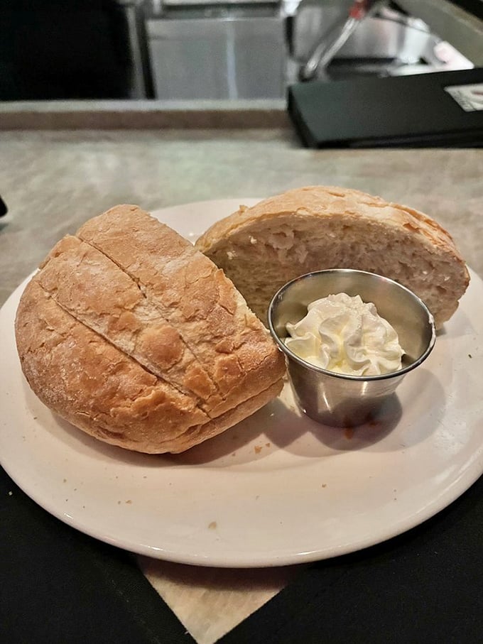 Bread that makes you question your carb-avoiding life choices. Warm, crusty sourdough with whipped butter—civilization's greatest achievement.