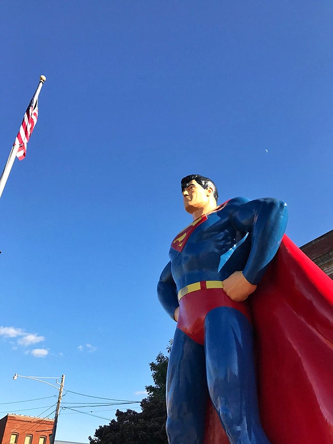 Blue skies frame the blue suit perfectly—Mother Nature clearly understands the importance of proper superhero color coordination.
