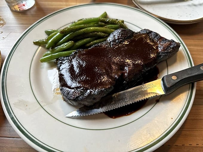 A perfectly seared steak that doesn't need a passport to transport you to heaven. Those green beans aren't just sidekicks—they're worthy companions.