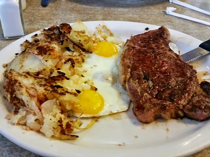 This isn't just breakfast, it's edible poetry—a perfectly seared steak alongside eggs that would make a chicken proud of its contribution.