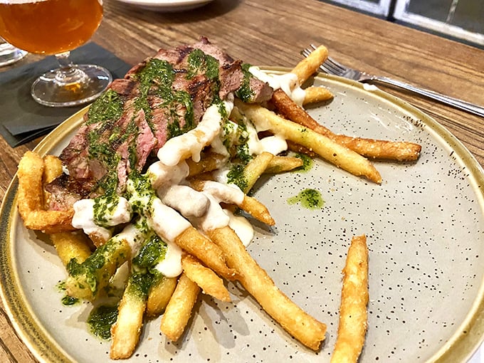 The star of the show: steak frites that would make a Parisian weep with joy. That chimichurri sauce isn't just green—it's money.