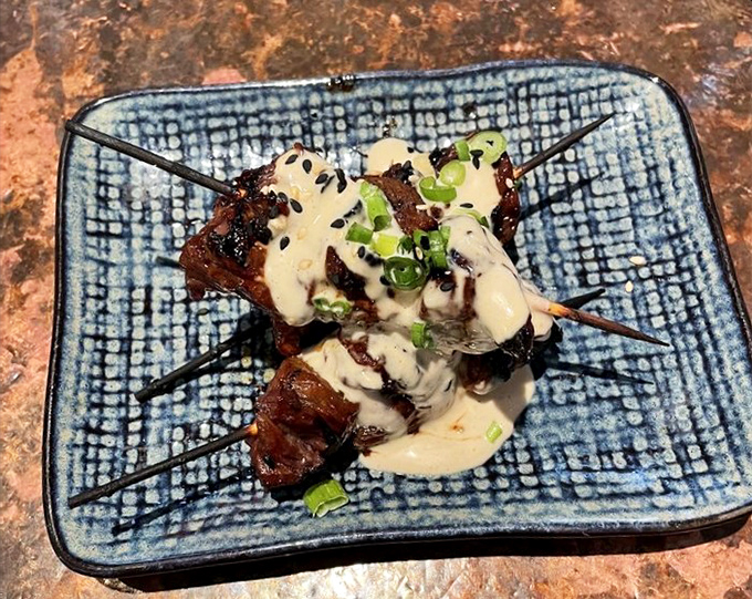 These skewers aren't just steak—they're meat transformed into art, drizzled with sauce that makes your taste buds do a standing ovation.