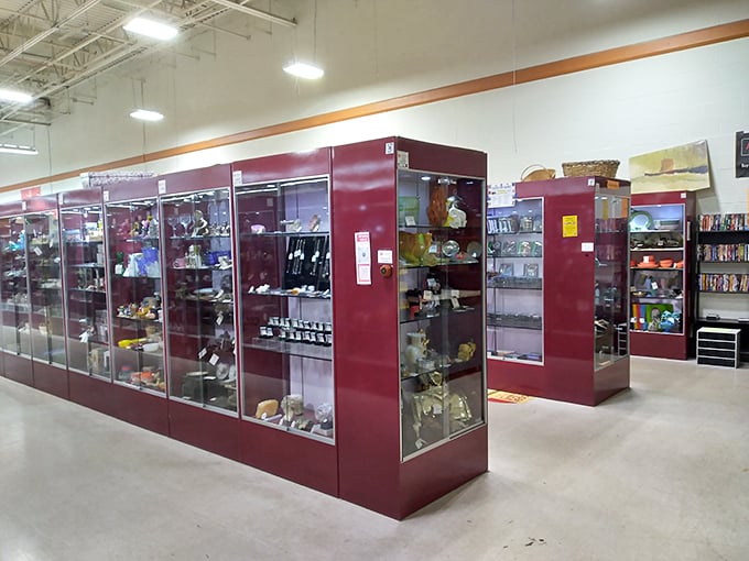 These gleaming display cases don't just hold collectibles—they're time capsules protecting memories from decades past, each shelf a different chapter of Americana.