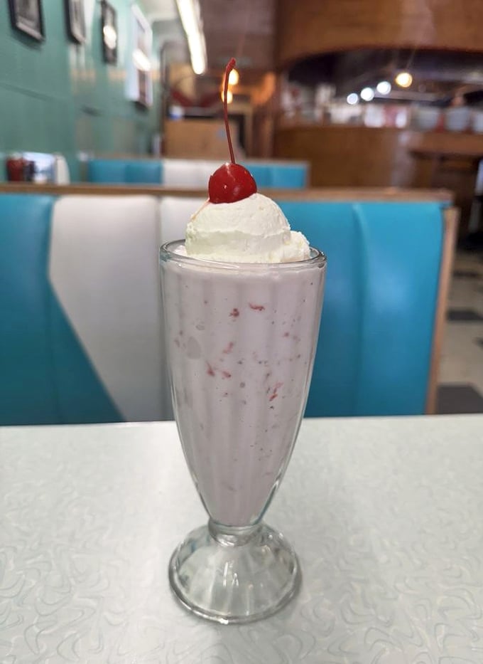The cherry on top isn't just decoration—it's the exclamation point at the end of a creamy sentence that reads, "This is how milkshakes were meant to be."