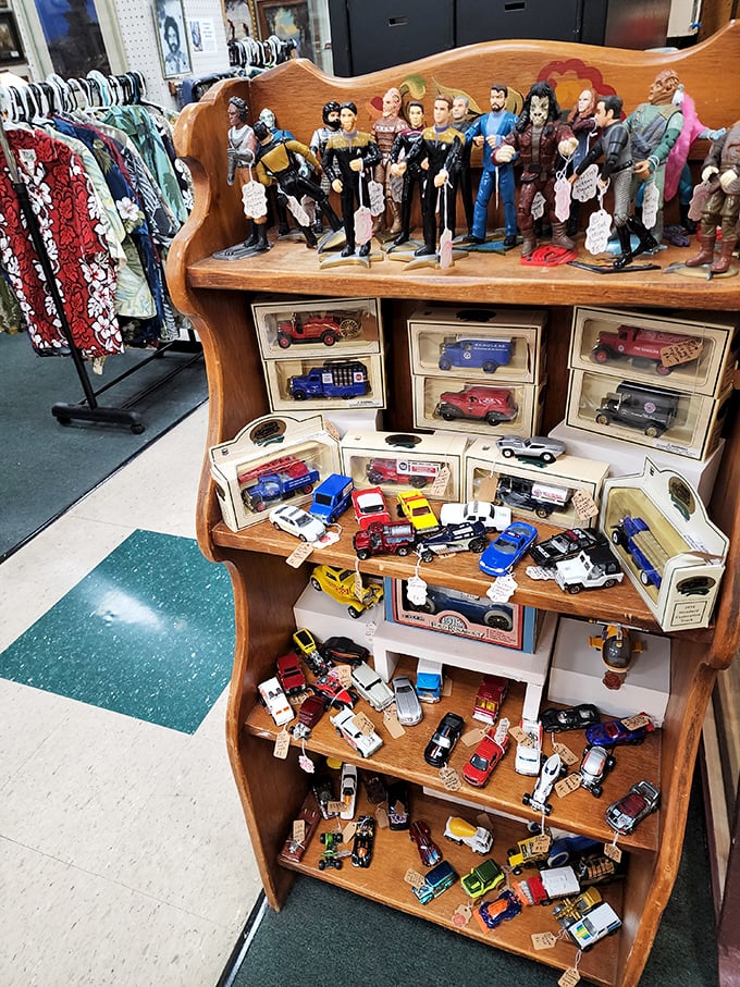 Star Trek figurines stand guard over vintage toy cars—proof that childhood nostalgia comes in all scales and galaxies.