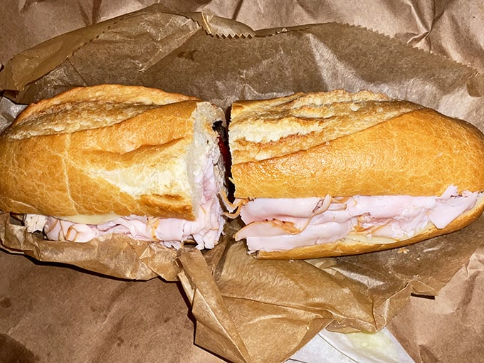This turkey sandwich isn't just lunch; it's architectural brilliance on a baguette, where each slice is layered with the precision of a Swiss watchmaker.