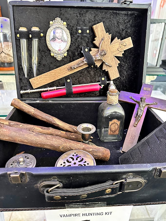 A vampire hunting kit complete with crucifix, wooden stakes, and holy water vials—essential tools for your next Transylvanian vacation.