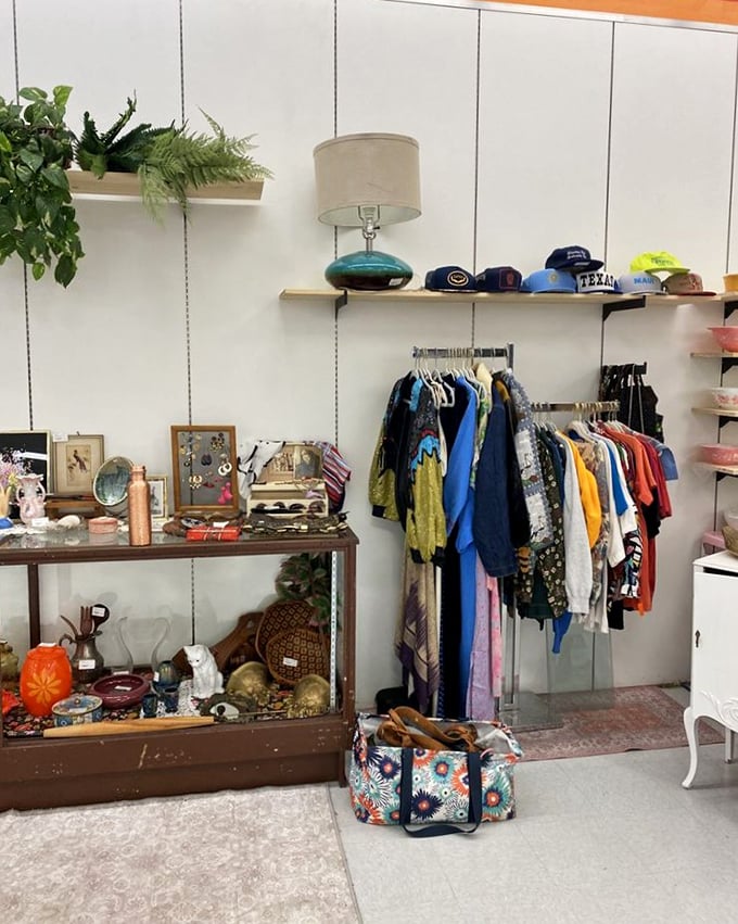 A perfectly curated corner where vintage clothing meets collectibles – someone's memories becoming another person's newfound treasures.