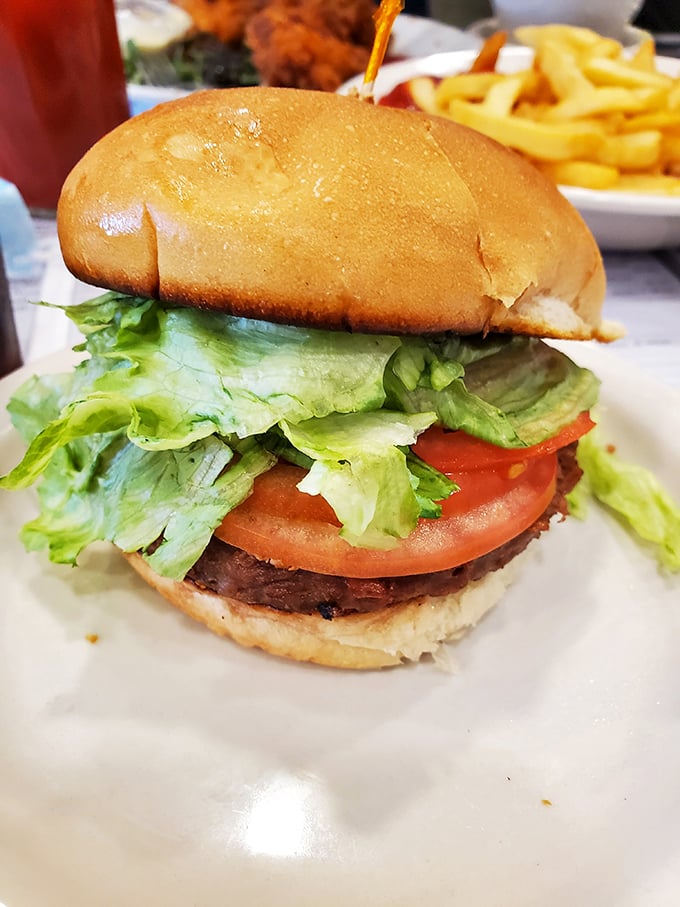 This isn't just a burger; it's a towering testament to fresh simplicity with lettuce and tomato so crisp they deserve their own fan club.
