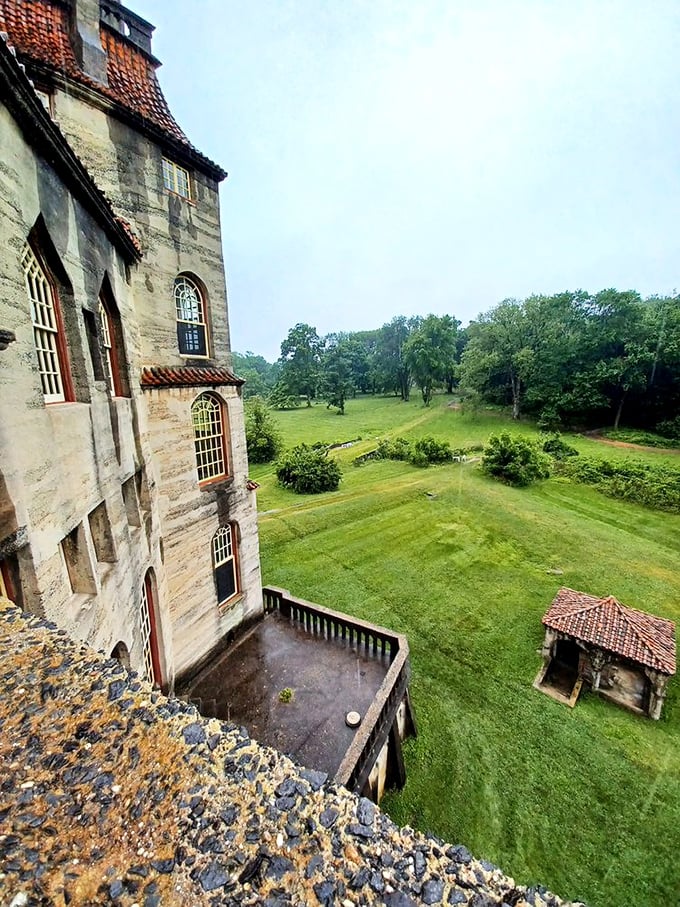 From this lofty perch, visitors can survey the castle's verdant grounds—a peaceful kingdom where concrete royalty reigns over manicured lawns.