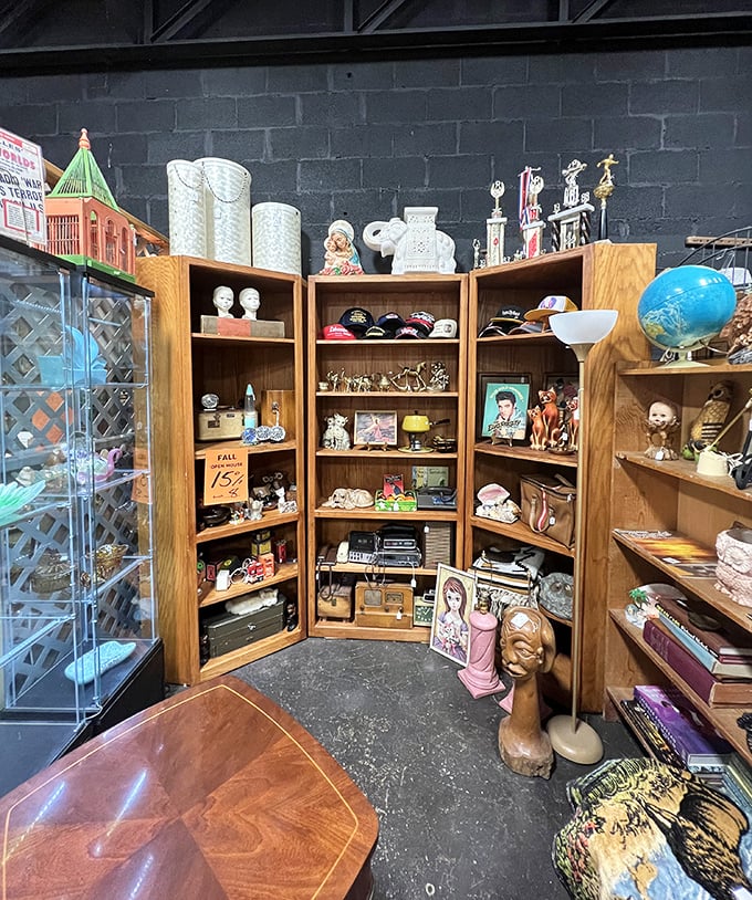 This wooden cabinet isn't just furniture—it's a time capsule housing Elvis memorabilia, vintage electronics, and knickknacks that whisper tales of Tennessee living.