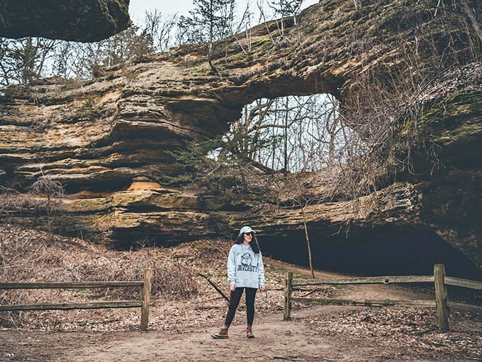 Standing beneath ancient history. The natural bridge frames visitors like a portal to another time when woolly mammoths roamed Wisconsin.