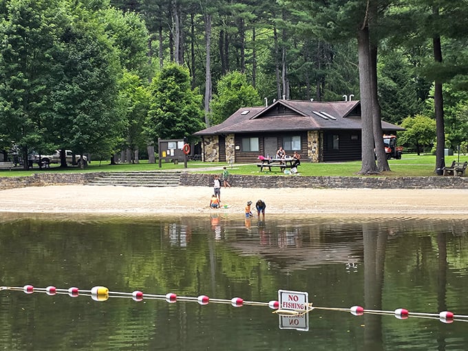 The swimming area proves that happiness doesn't require water slides – just cool creek water and sandy toes.