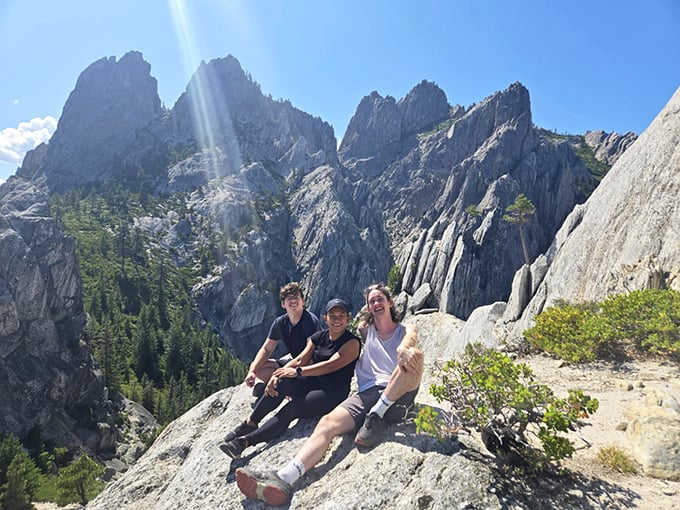 Happy hikers soak in million-dollar views after conquering the trail. That post-hike glow isn't just sunburn—it's the satisfaction of earning these spectacular vistas.