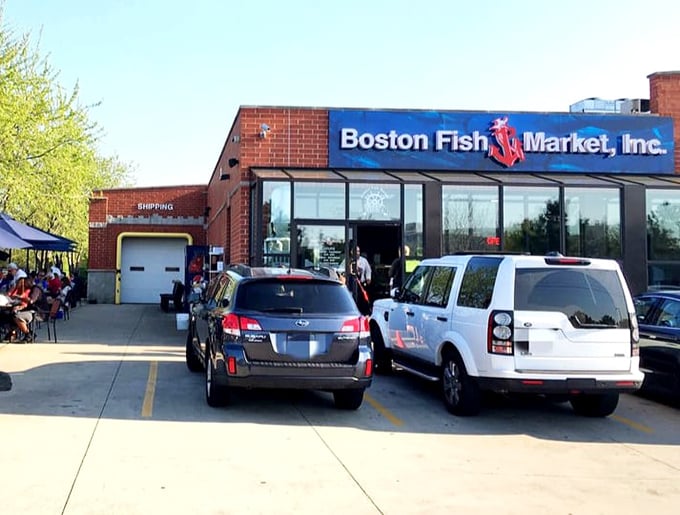 Boston Fish Market's busy parking lot tells the real story—fresh seafood draws serious crowds.