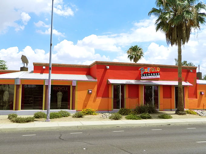 Buffalo Exchange's vibrant orange and red exterior pops against the Tucson landscape like a fashion-forward sunset.