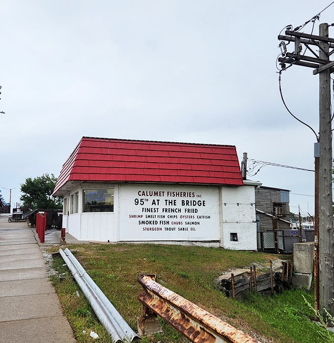 Calumet Fisheries stands proudly at the bridge – a tiny white building with a red roof and smoking skills that would make a pitmaster jealous.