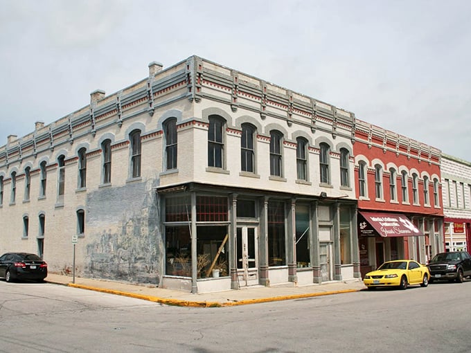 This street has a wonderful energy, with each old building showing off its unique character under the blue sky.