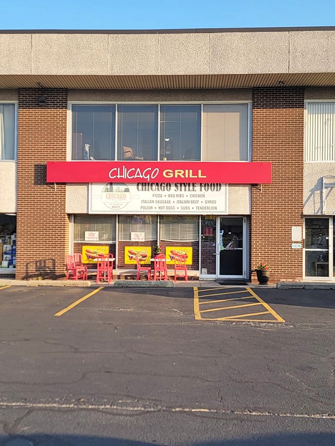 Red chairs outside signal good times ahead – like a pizza party waiting to happen.