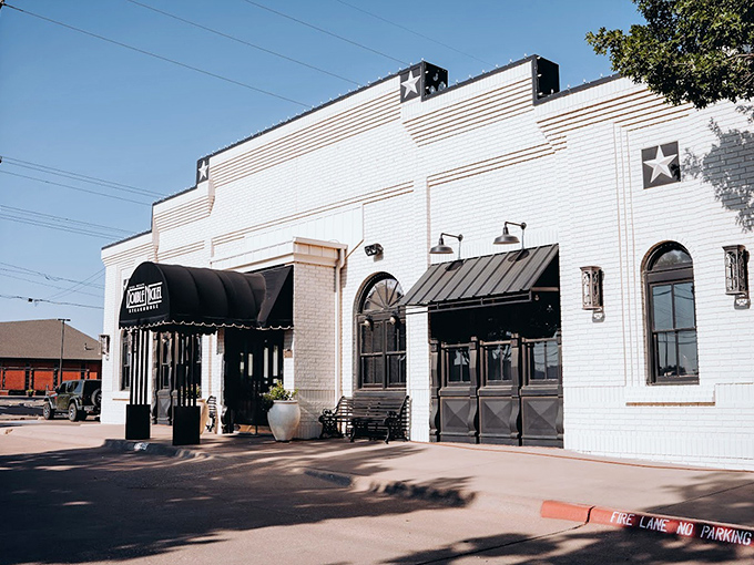 Double Nickel's elegant white brick building stands proud. Those Texas stars on the facade hint at the stellar steaks waiting inside.