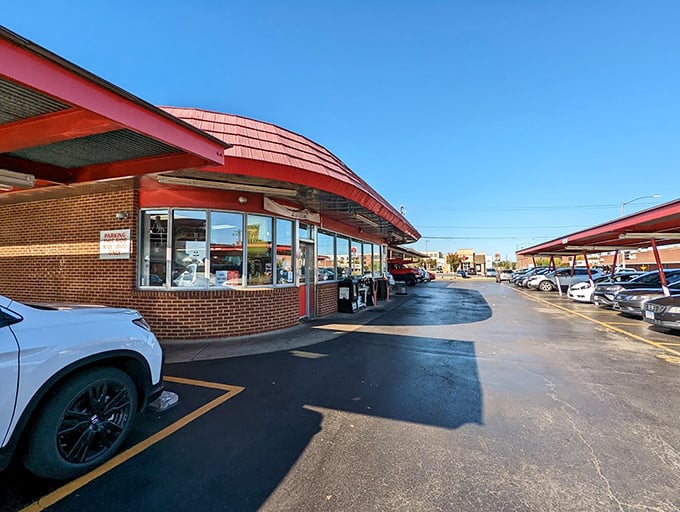 That swooping red roof design screams retro Americana, where ice cream cones and barbecue create perfect harmony.