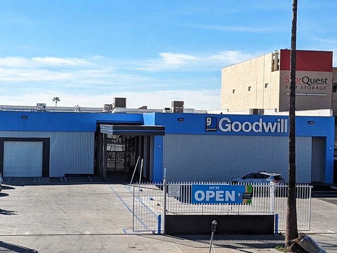 Goodwill's blue beacon calls bargain hunters like a lighthouse guides ships to safe harbor.