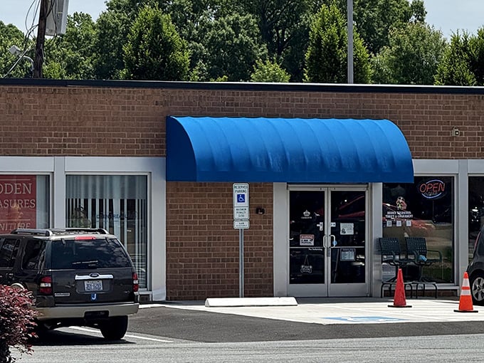 That blue awning isn't just a sunshade—it's the entrance to a parallel universe where designer labels don't require a second mortgage.