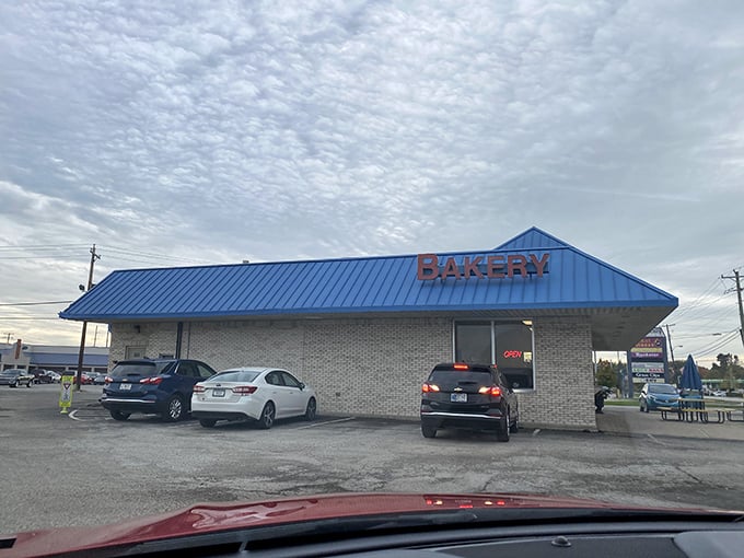 That blue roof signals sweet relief ahead – a beacon of frosted hope in a sea of ordinary breakfasts.