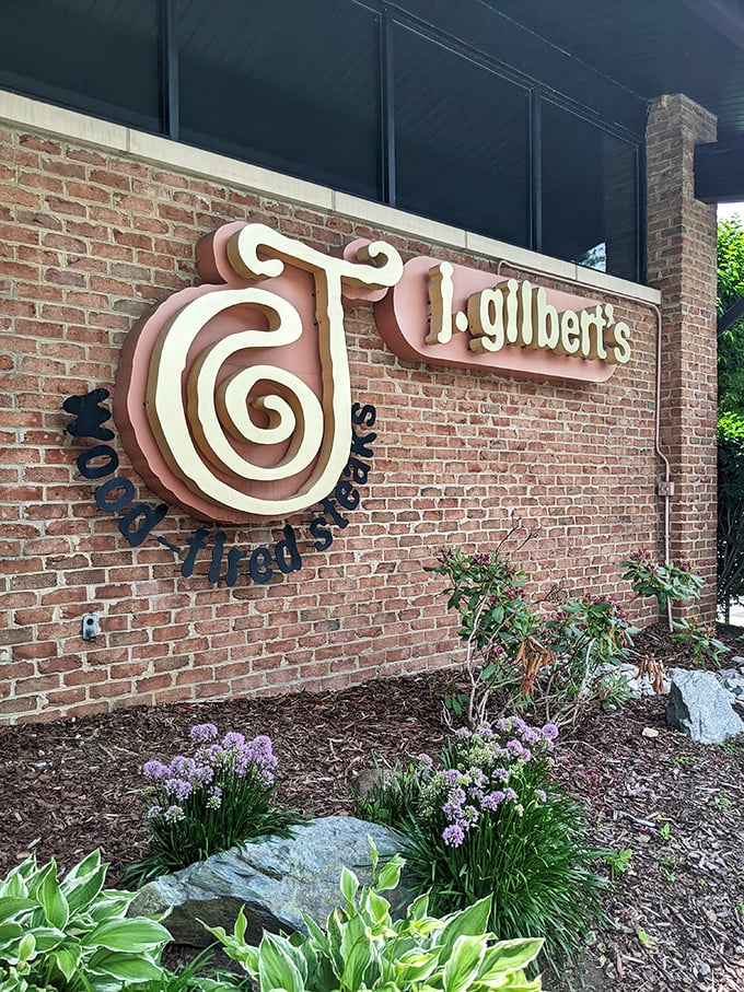 J. Gilbert's brick facade hints at the wood-fired magic happening behind those welcoming doors.