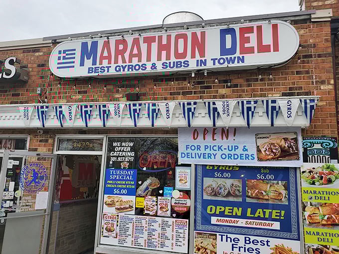 Marathon Deli's vibrant blue and white façade celebrates its Greek heritage. Those flags aren't just decoration—they're a flavor promise!