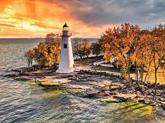 Marblehead Lighthouse stands guard like a faithful old friend, weathering storms with timeless grace.