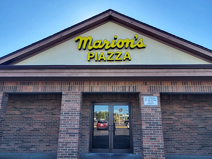 Marion's bright yellow sign is like a pizza lighthouse. The "Piazza" might sound fancy, but inside awaits pure Ohio comfort.