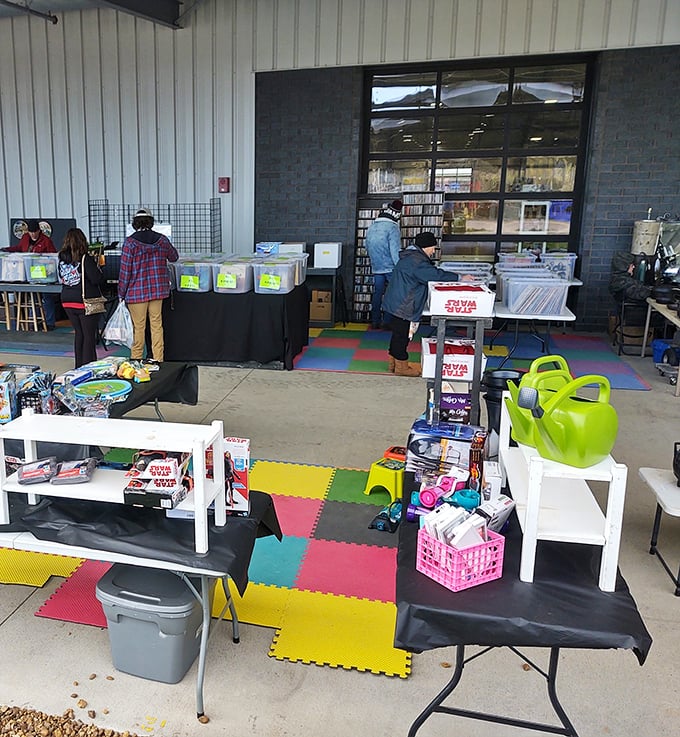Colorful foam mats create a kid-friendly zone where Star Wars meets serious flea market business.