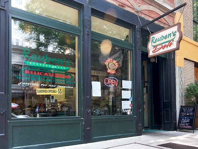 Reuben's classic green storefront whispers "authentic deli" louder than any neon sign ever could.
