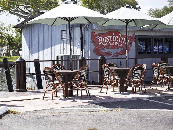 The Rustic Inn's weathered exterior is like a treasure map – X marks the spot for garlic crab that'll haunt your dreams.