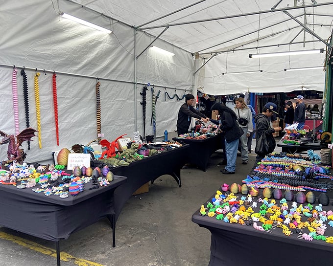 Dragon's den of delights! These colorful creatures at Santa Fe Springs seem ready to spring to life under twinkling lights like a carnival of plastic fantastics.