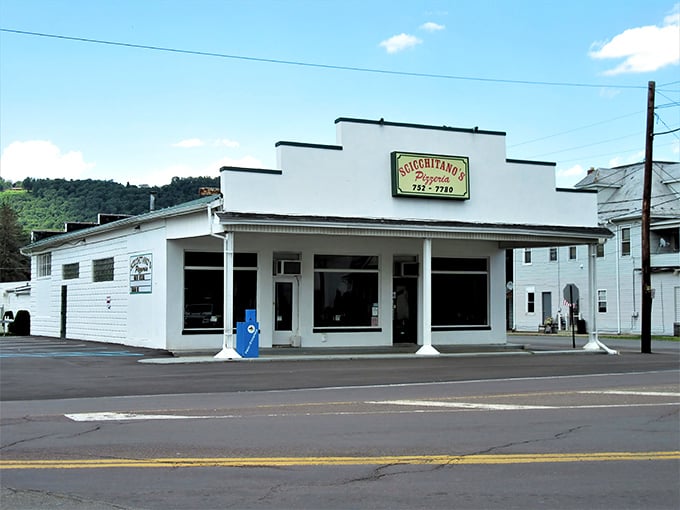 The simple white building with classic signage – pizza's version of "don't judge a book by its cover."