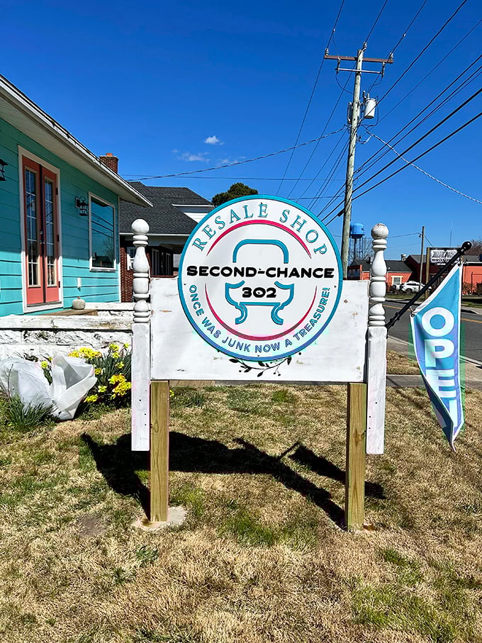 That turquoise cottage with its cheerful sign isn't just a shop—it's a philosophy. Yesterday's junk, today's treasure, tomorrow's conversation piece.