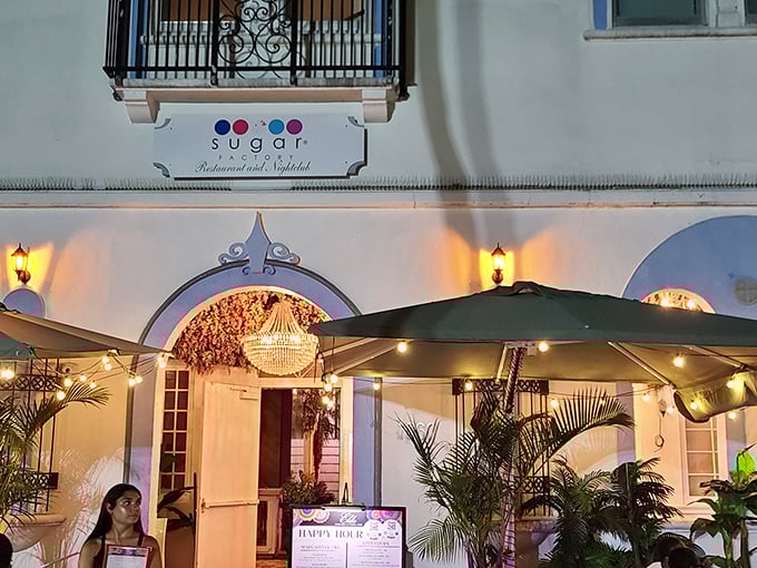 Elegant arches whisper sweet secrets while sugar magic happens behind these sophisticated Miami Beach windows.