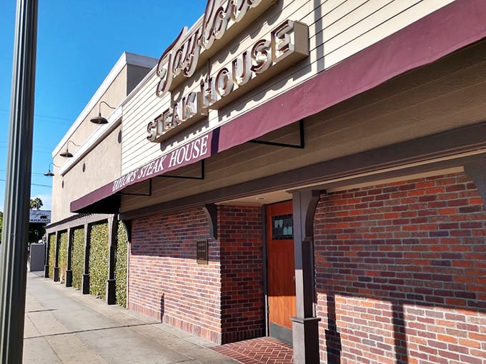 Taylor's brick exterior hints at the old-school steakhouse experience waiting inside – Mad Men vibes with modern-day flavor.