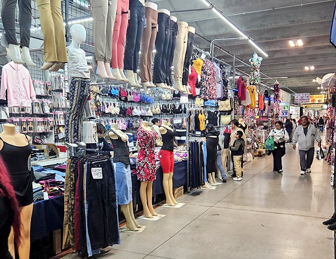 Rows of colorful clothing stretch like a rainbow through The Buyers Flea Market - fashion finds for every style imaginable.