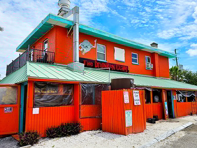 The Drunken Clam's vibrant orange building stands out like a life vest in the ocean – impossible to miss and potentially life-saving for the hungry.
