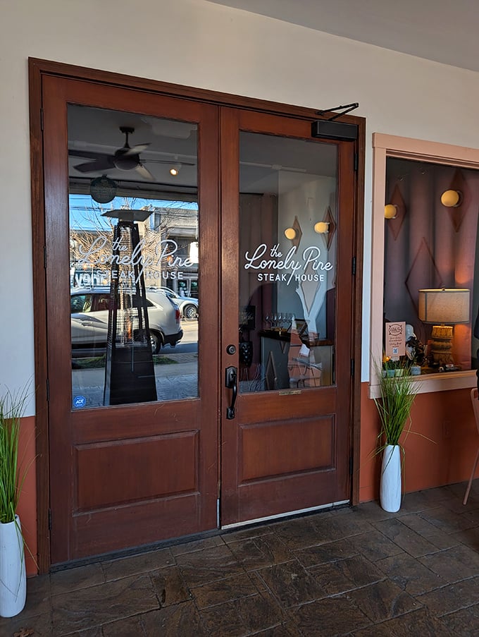 Lonely Pine's welcoming entrance invites you into a modern steakhouse where comfort meets culinary excellence.